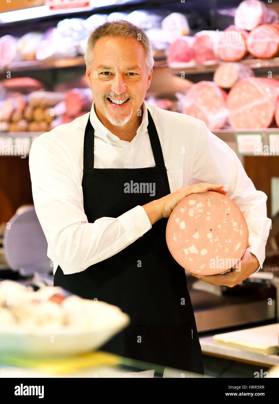 Shopkeeper working in his grocery store Stock Photo - Alamy