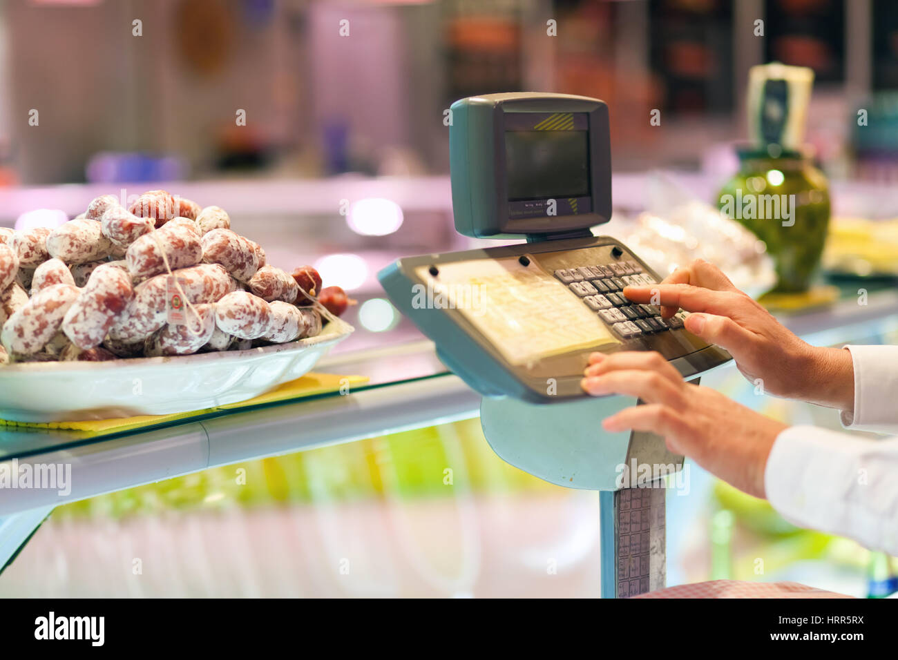 Shopkeeper cheking the food weight Stock Photo - Alamy