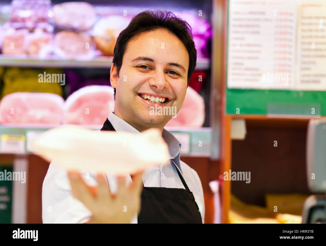 Shopkeeper working in his grocery store Stock Photo - Alamy