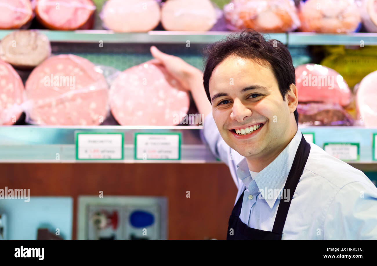 Shopkeeper working in his grocery store Stock Photo - Alamy