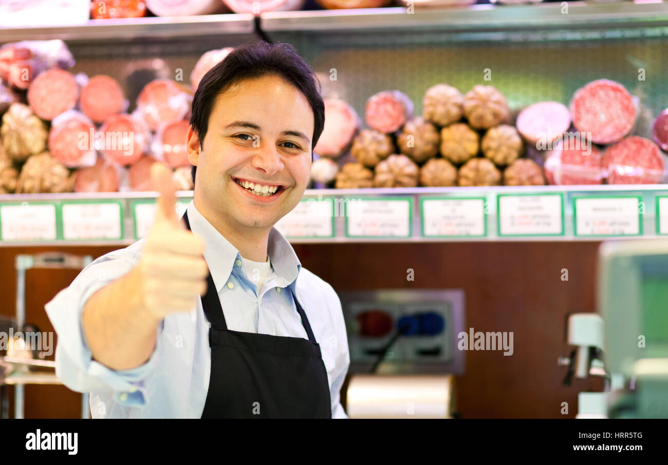 Shopkeeper working in his grocery store Stock Photo - Alamy