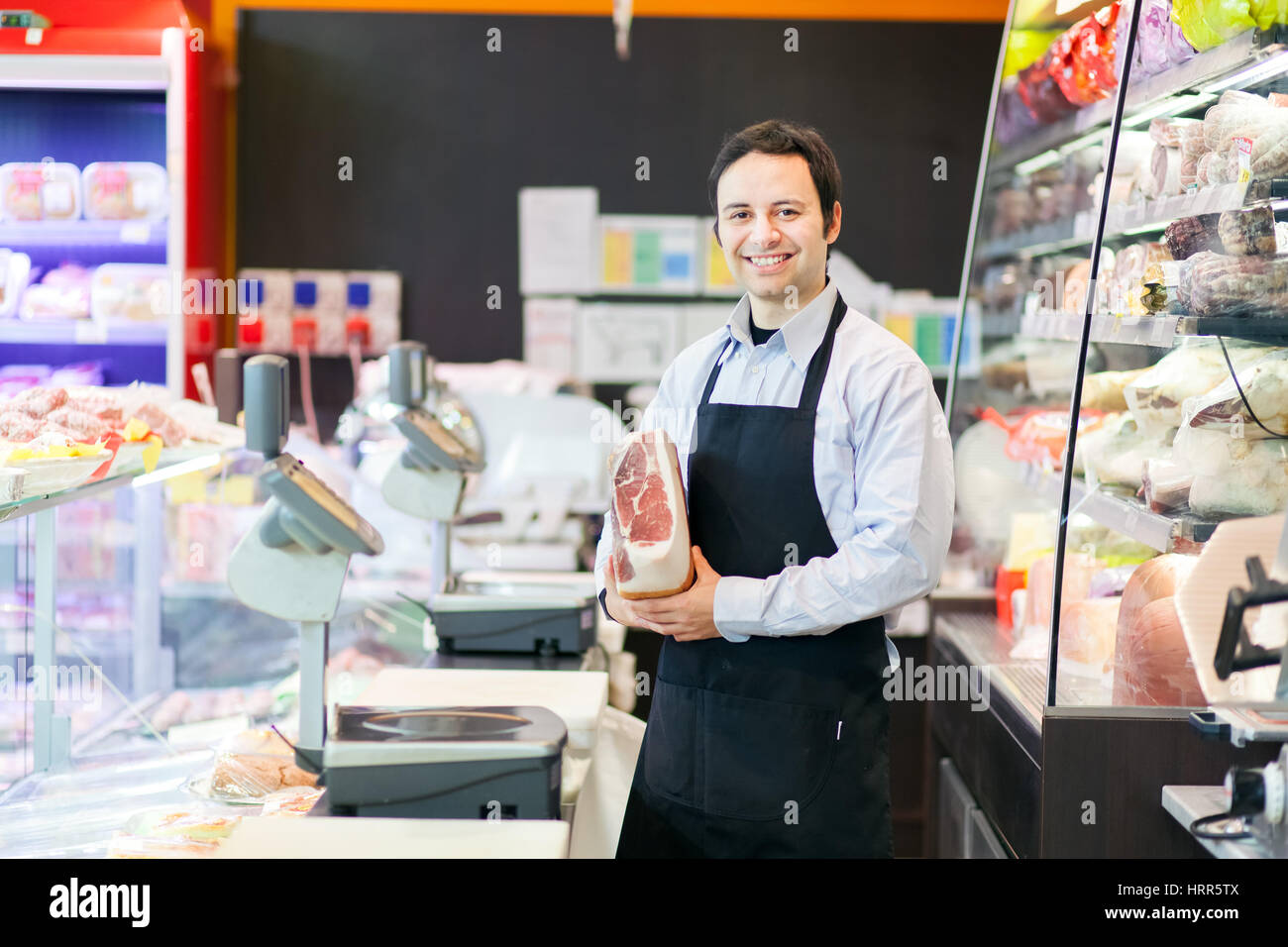 Smiling shopkeeper hi-res stock photography and images - Alamy