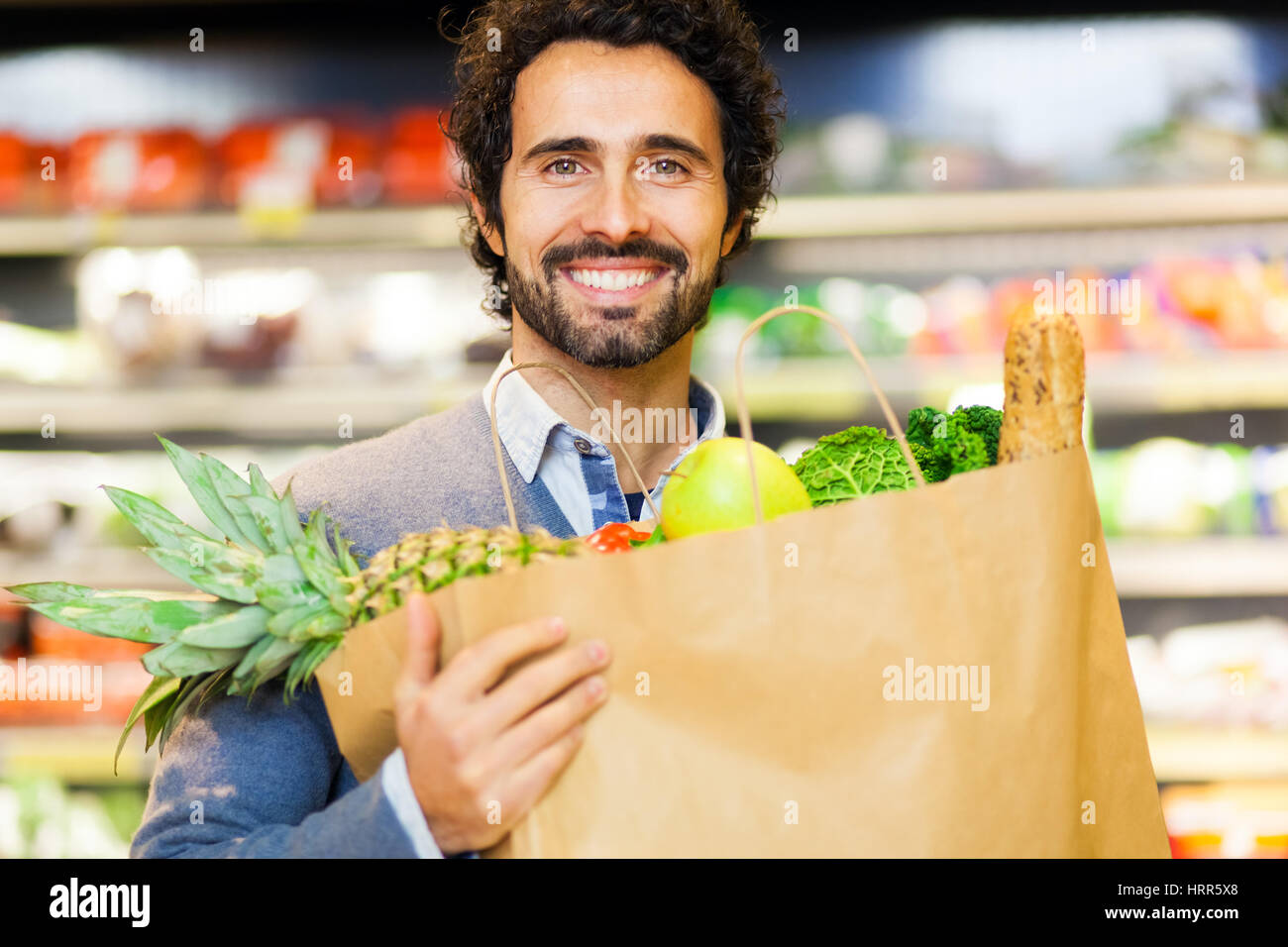 Man shopping in a supermarket Stock Photo - Alamy