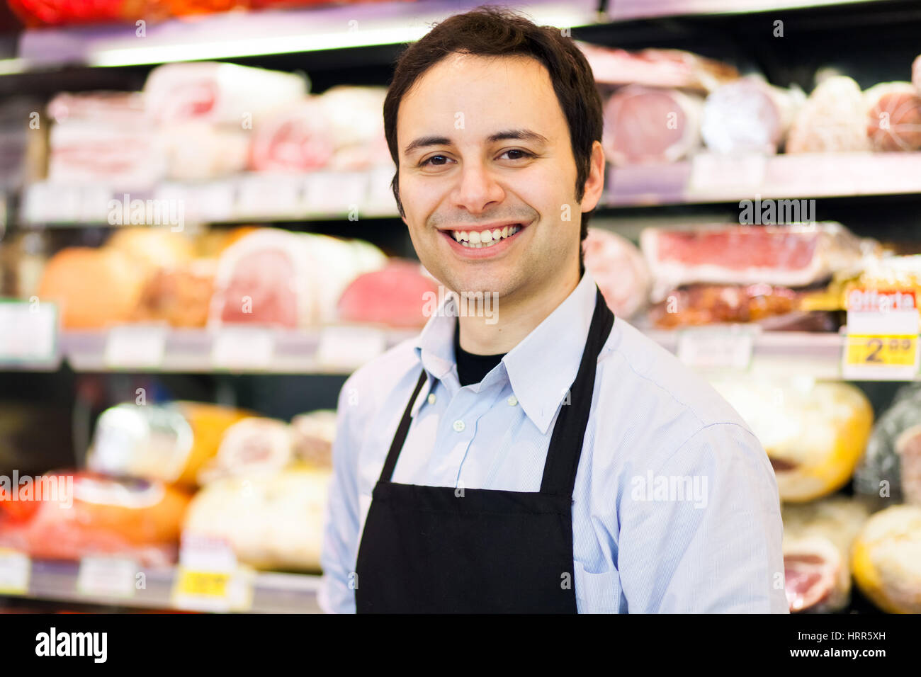 Smiling shopkeeper hi-res stock photography and images - Alamy