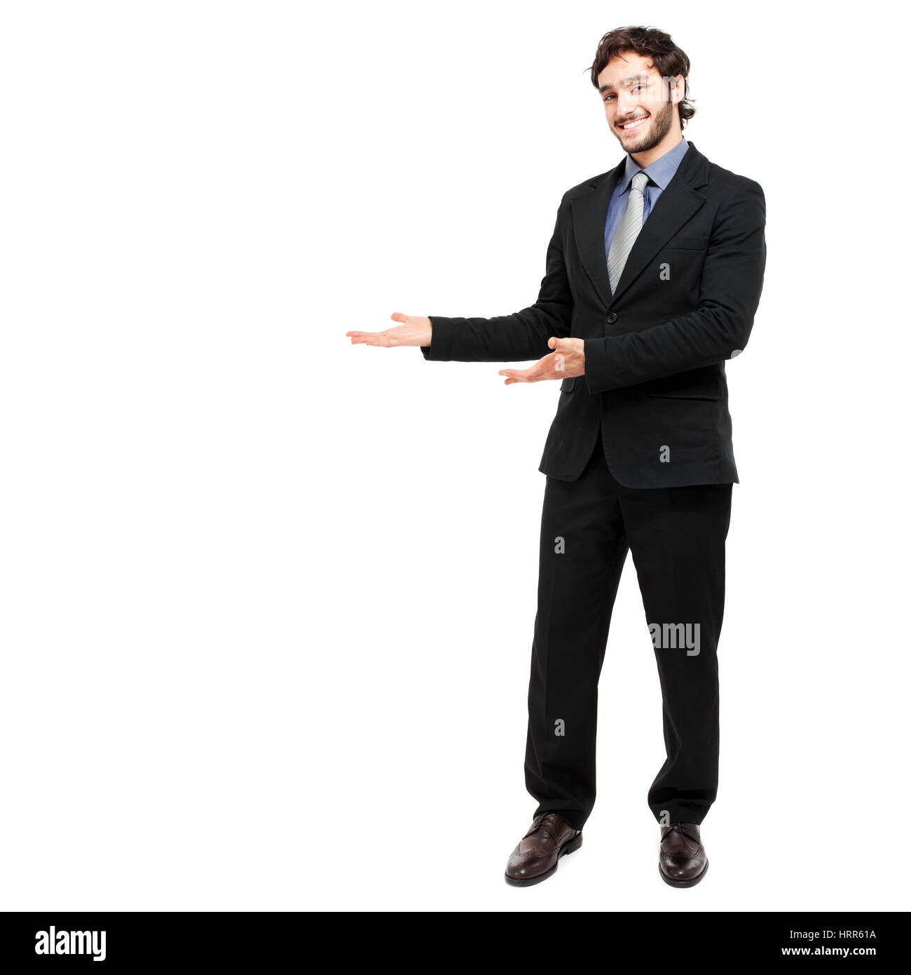 Young business man welcoming you Stock Photo - Alamy