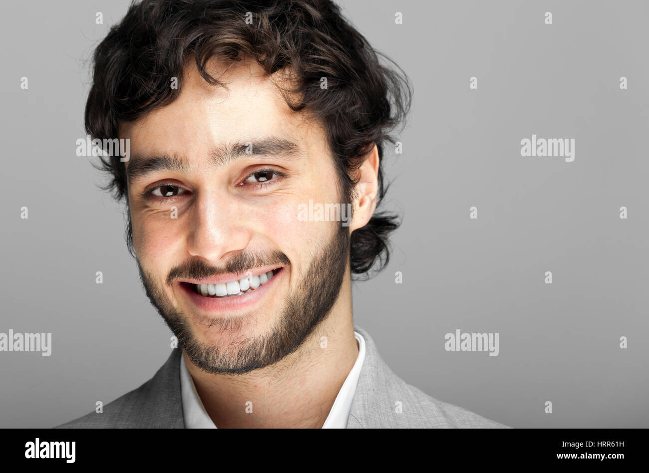 Man against grey background Stock Photo - Alamy