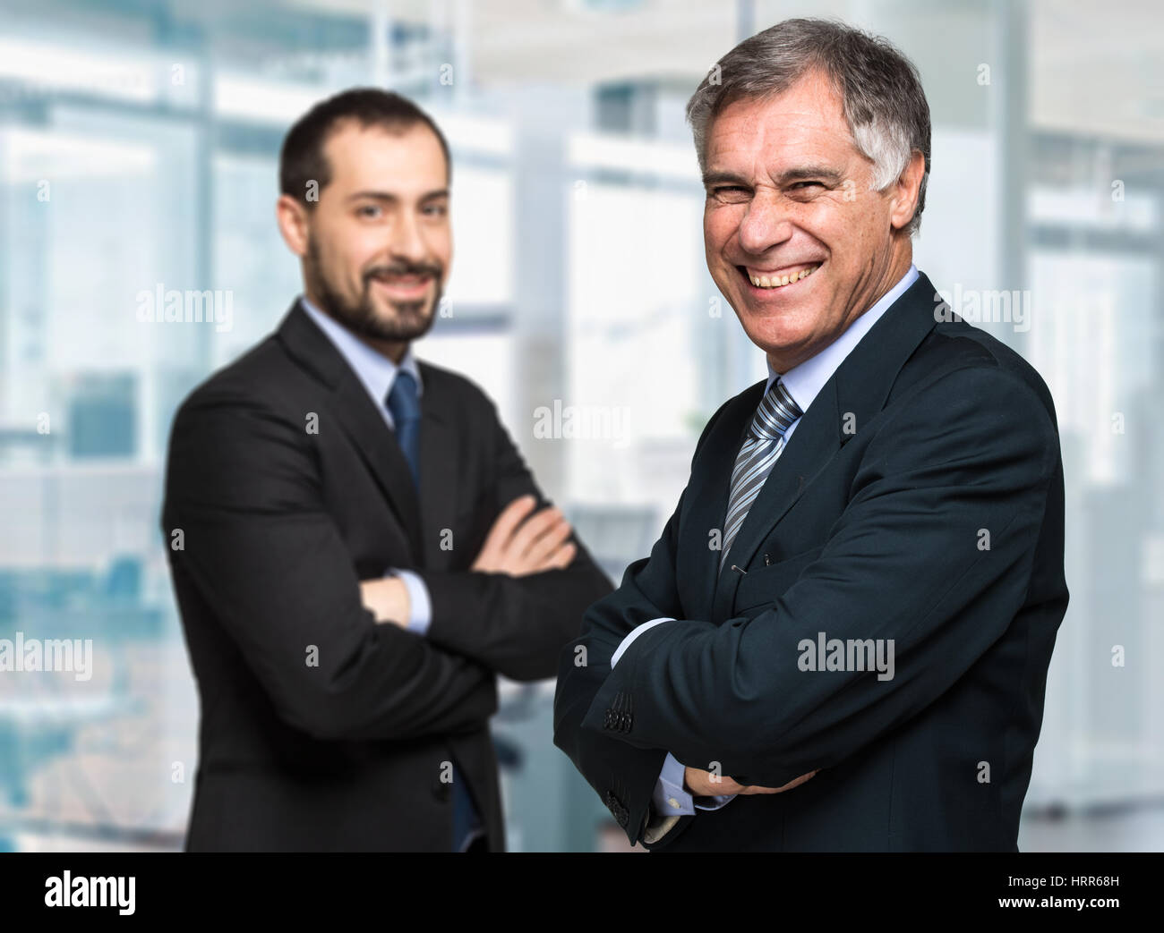 Two smiling businessmen Stock Photo - Alamy