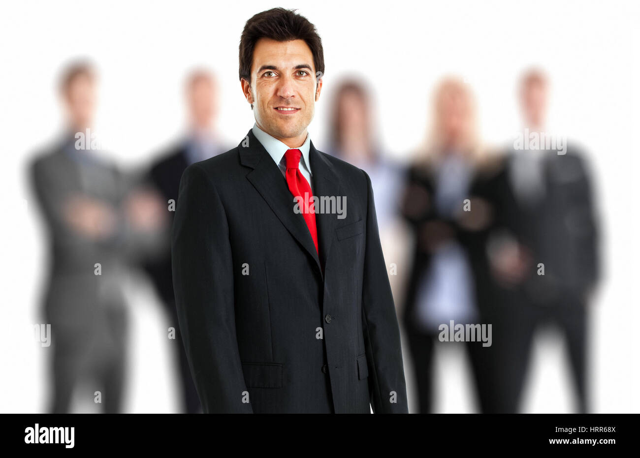 Male business leader in front if his team Stock Photo - Alamy