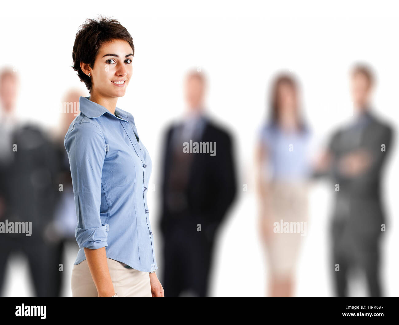 Portrait of a female manager in front of her team Stock Photo - Alamy