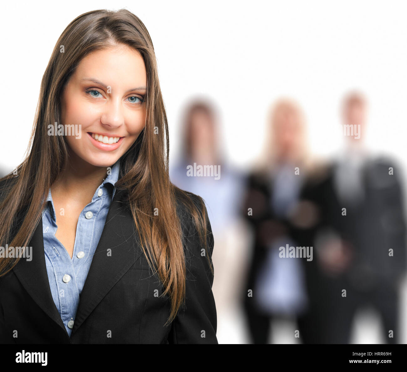 Portrait of a female manager in front of her team Stock Photo - Alamy