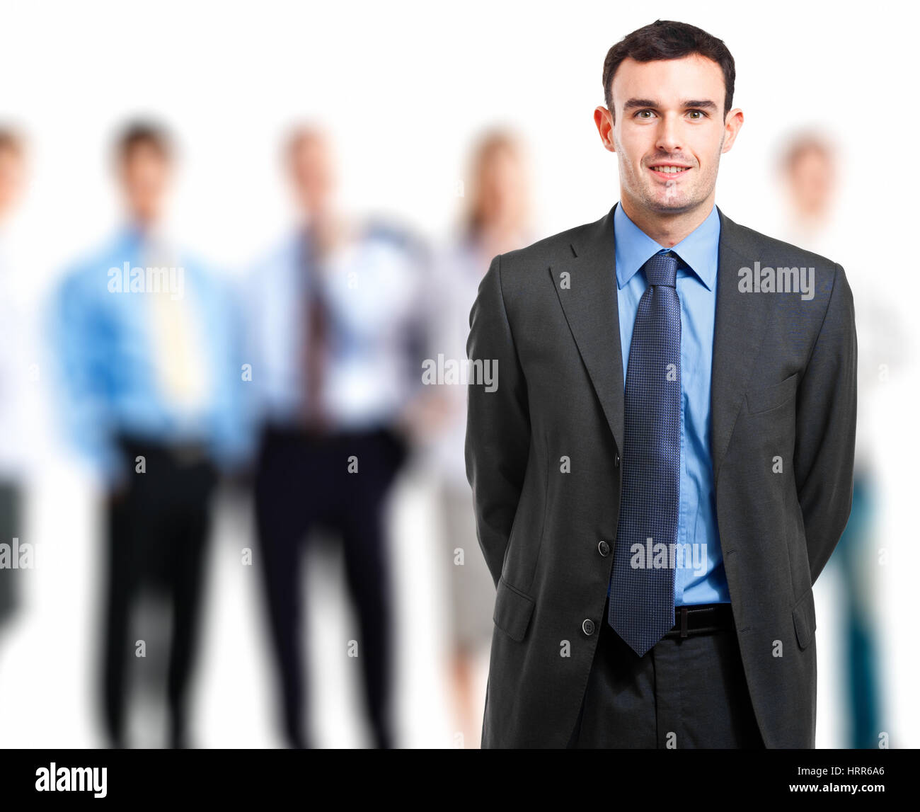 Male businessman with his team Stock Photo - Alamy
