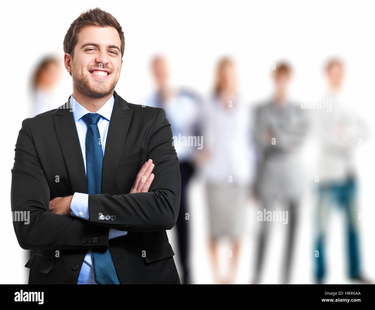 Male businessman with his team Stock Photo - Alamy
