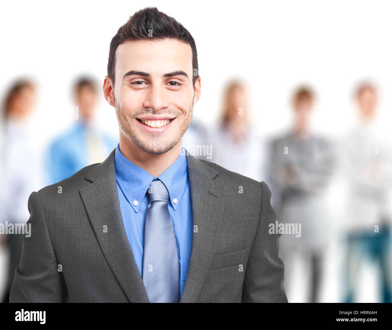 Male businessman with his team Stock Photo - Alamy