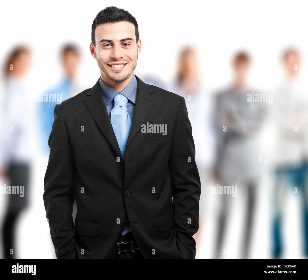 Male businessman with his team Stock Photo - Alamy