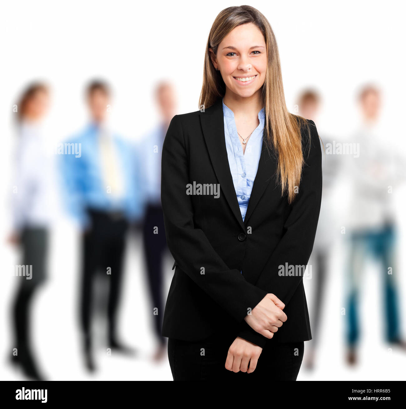 Portrait of a female manager in front of her team Stock Photo - Alamy
