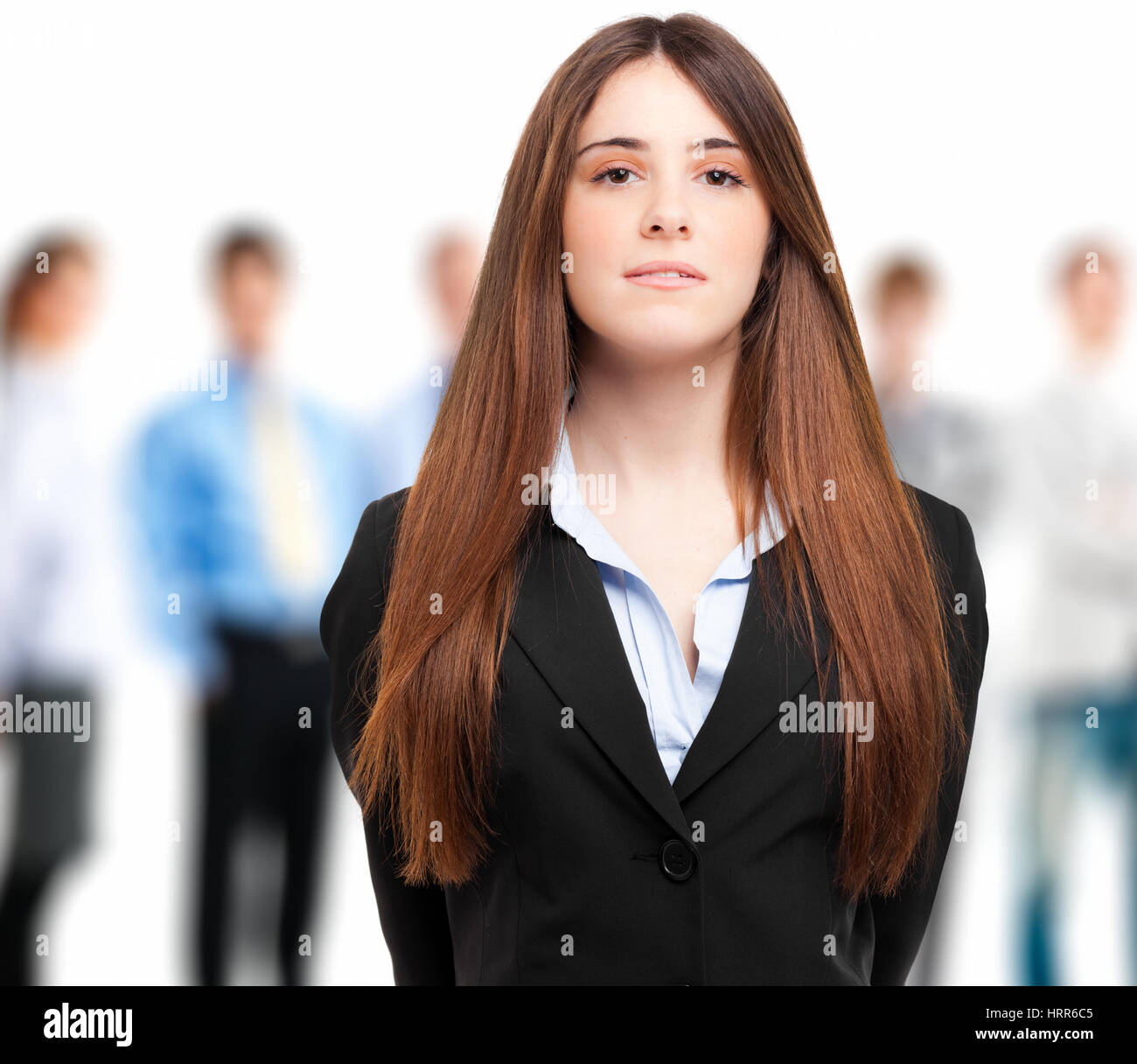 Portrait of a female manager in front of her team Stock Photo - Alamy