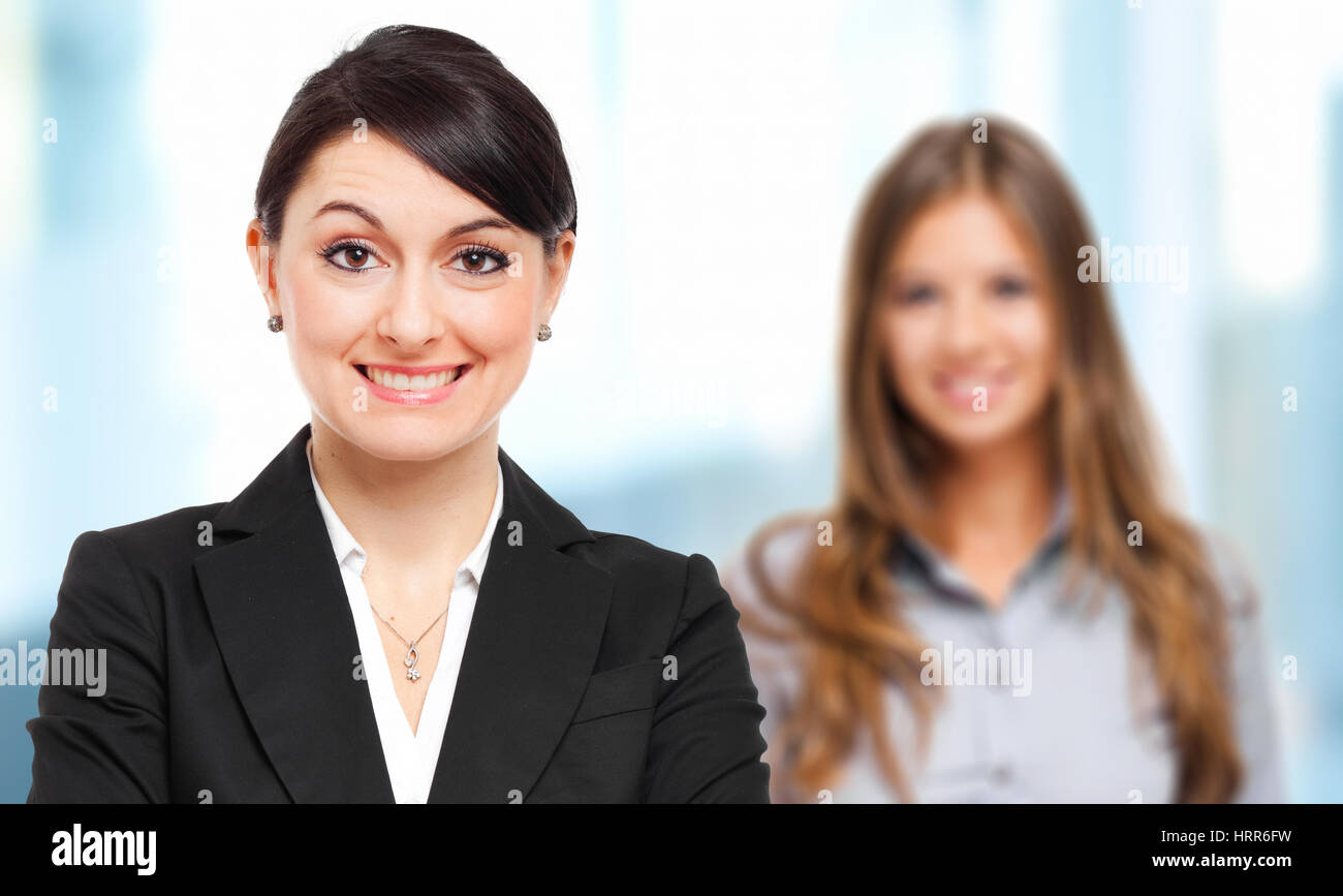 Two smiling business woman Stock Photo - Alamy
