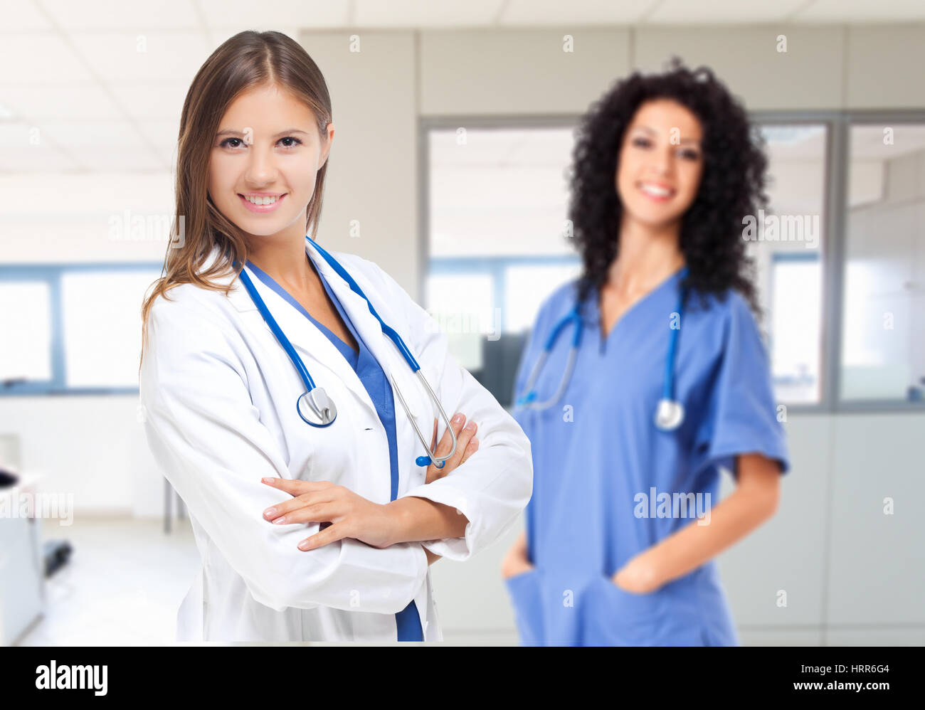 Two smiling female doctors Stock Photo - Alamy