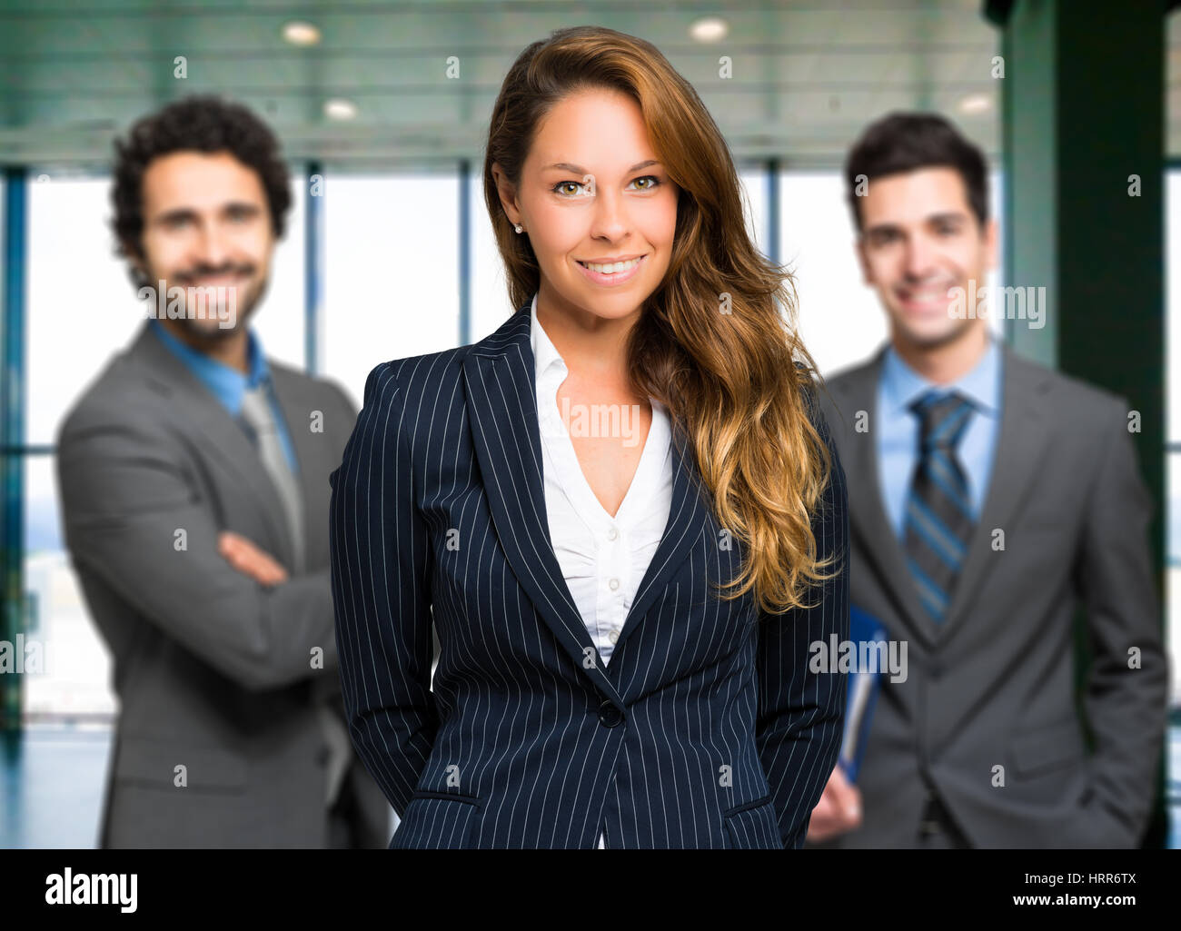Portrait of happy business partners looking at camera Stock Photo - Alamy