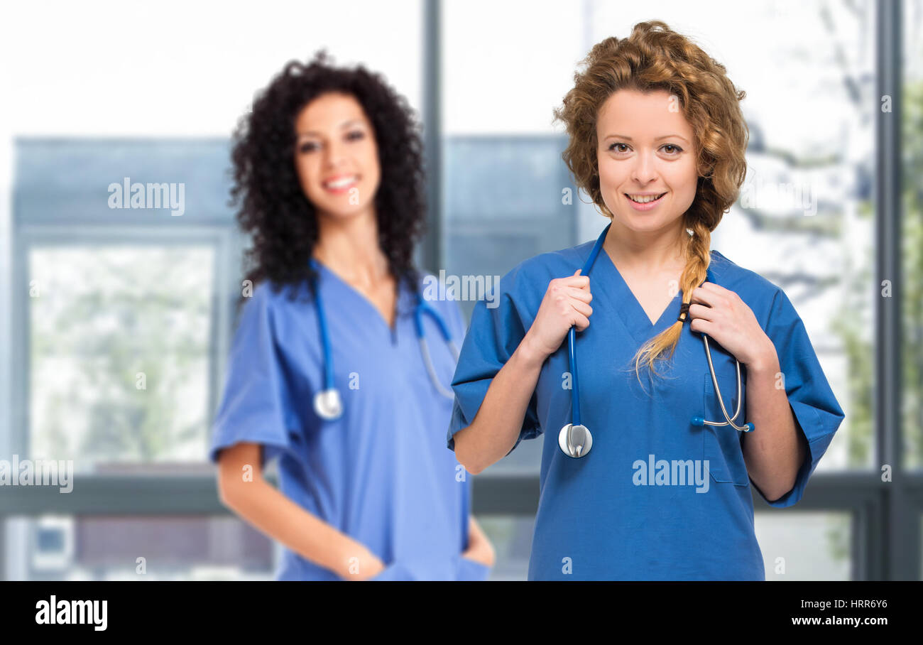 Portrait of two attractive medical workers Stock Photo - Alamy