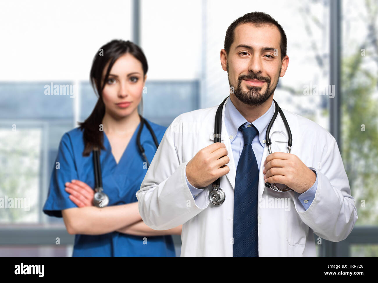 Portrait of two smiling medical workers Stock Photo - Alamy