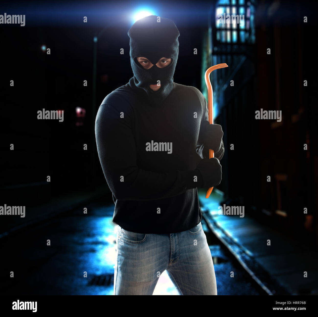 Thief holding a crowbar Stock Photo - Alamy