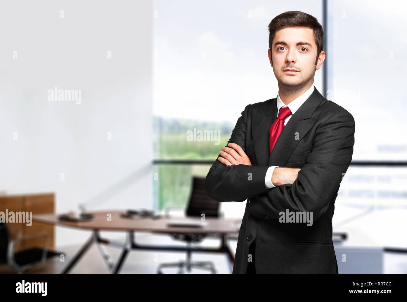 Confident young manager in his office Stock Photo - Alamy
