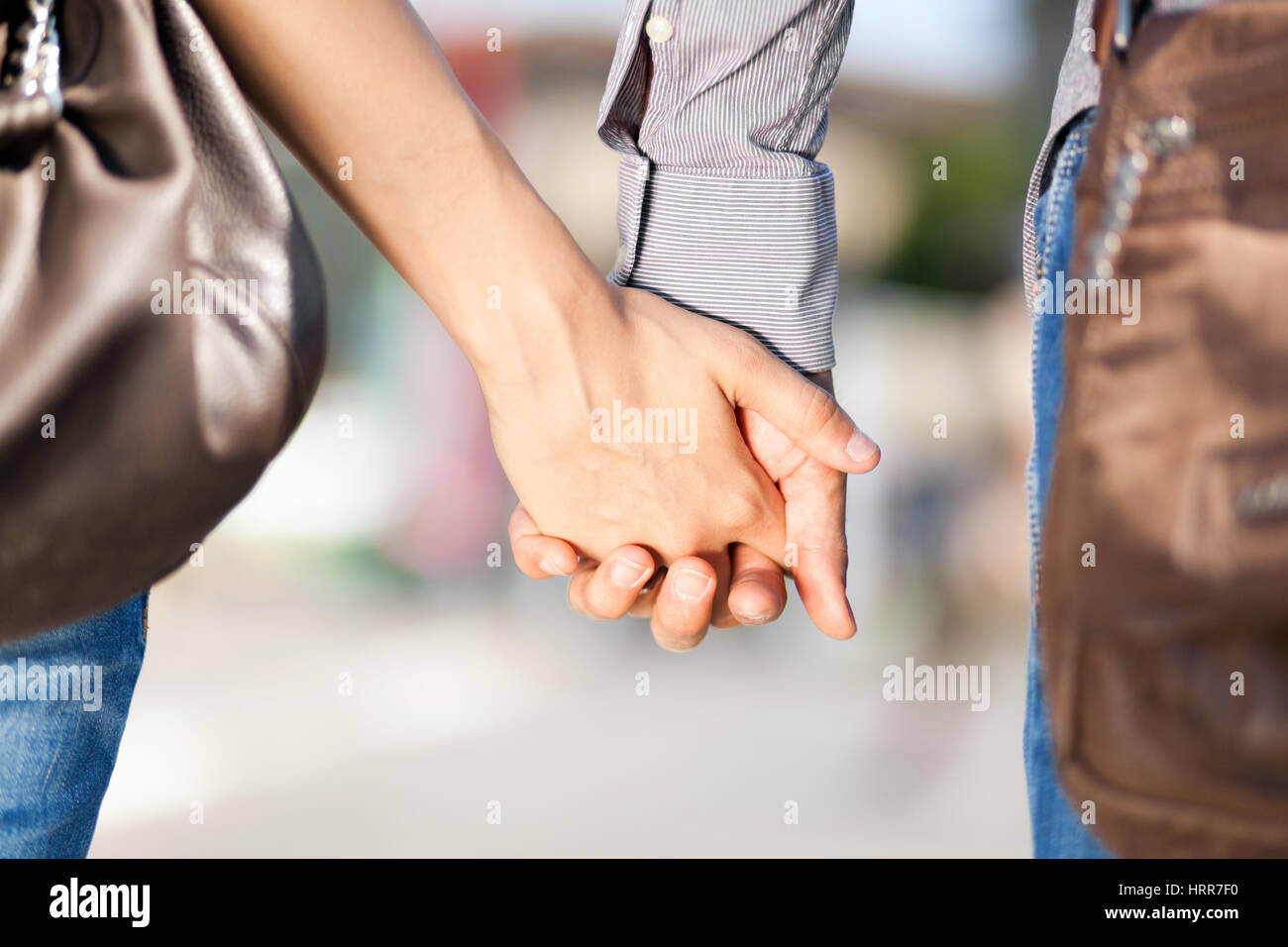 Couple goes hand in hand Stock Photo - Alamy