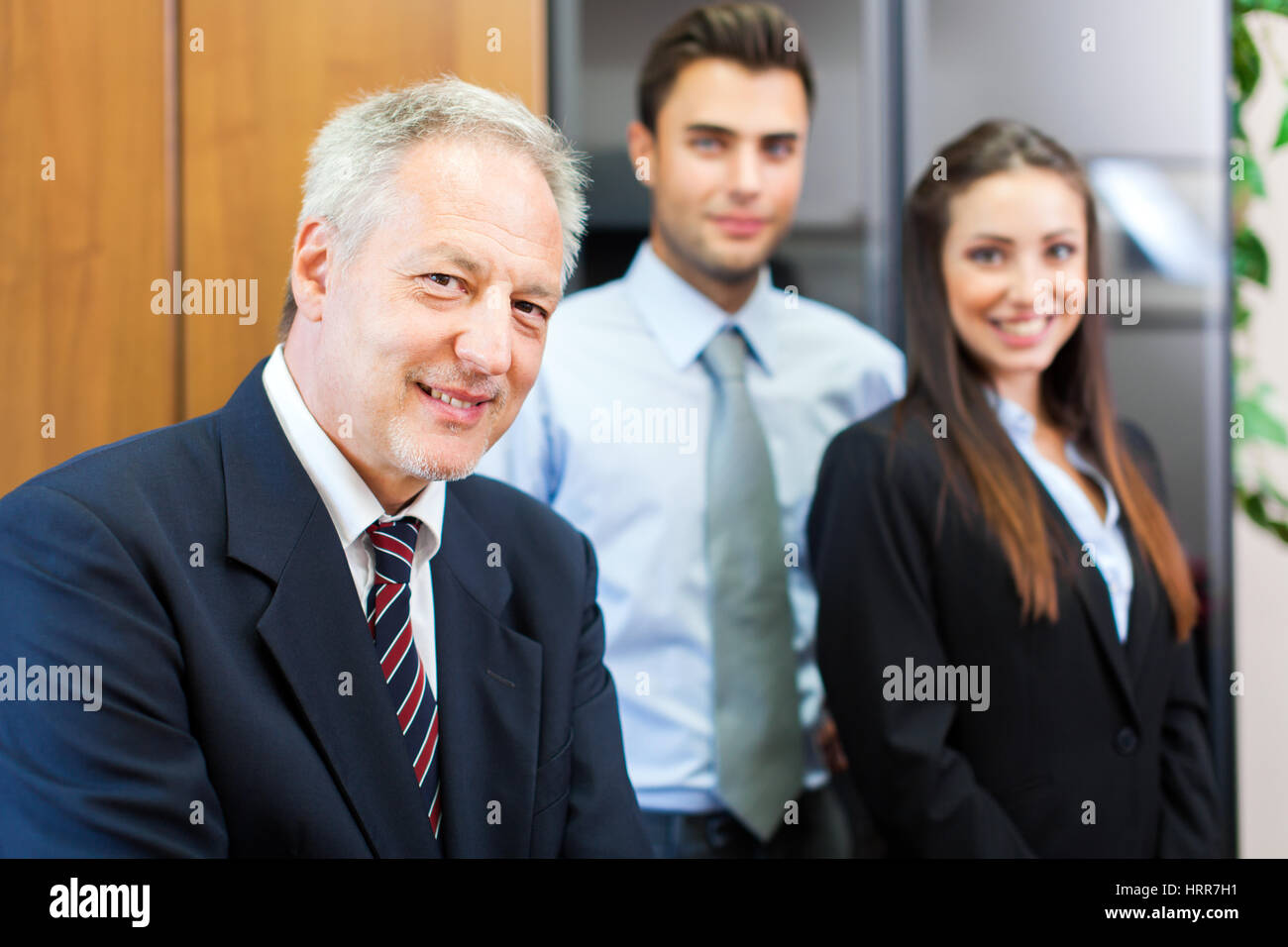 Portrait of happy business partners looking at camera Stock Photo - Alamy