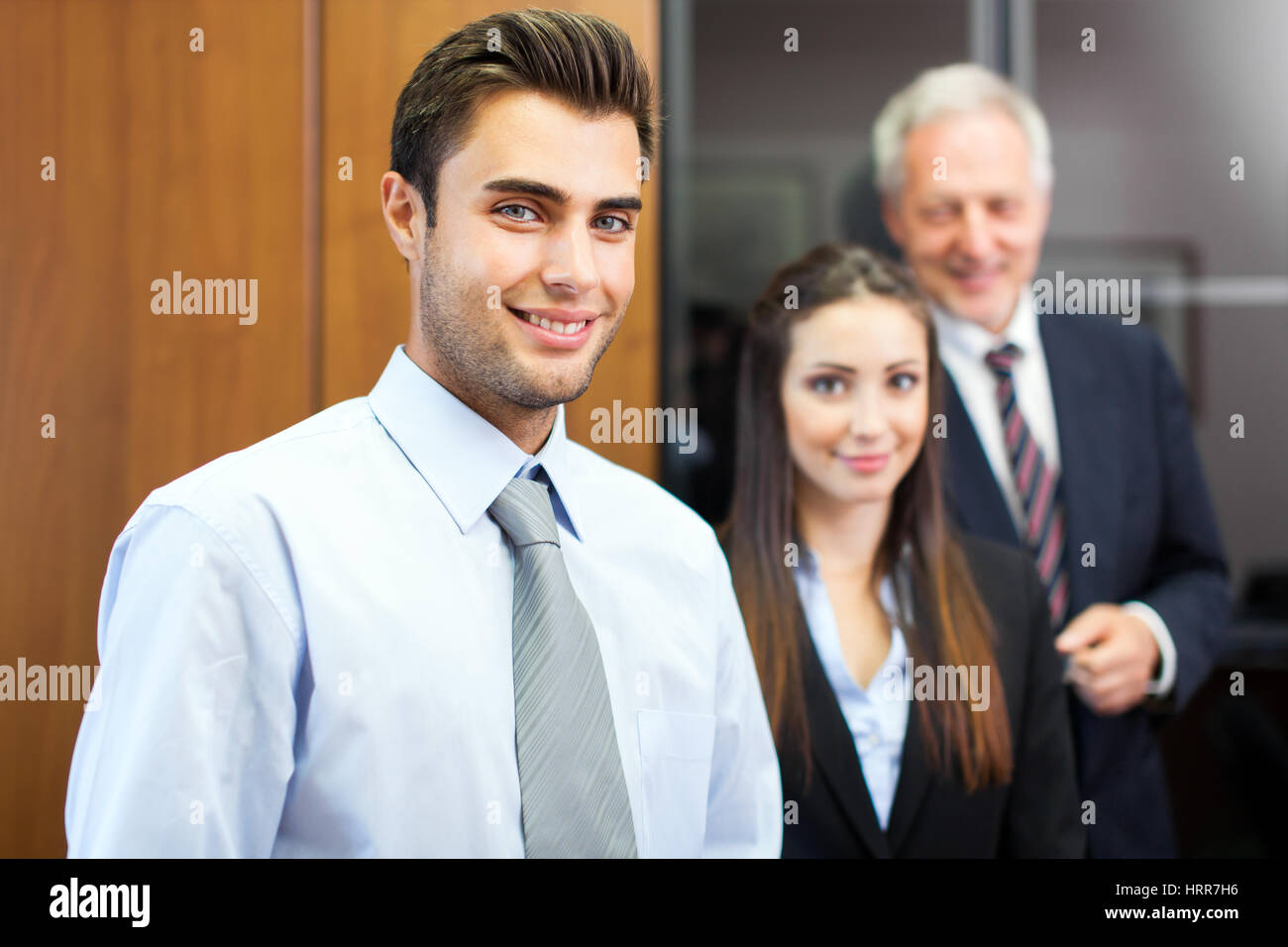 Portrait of happy business partners looking at camera Stock Photo - Alamy