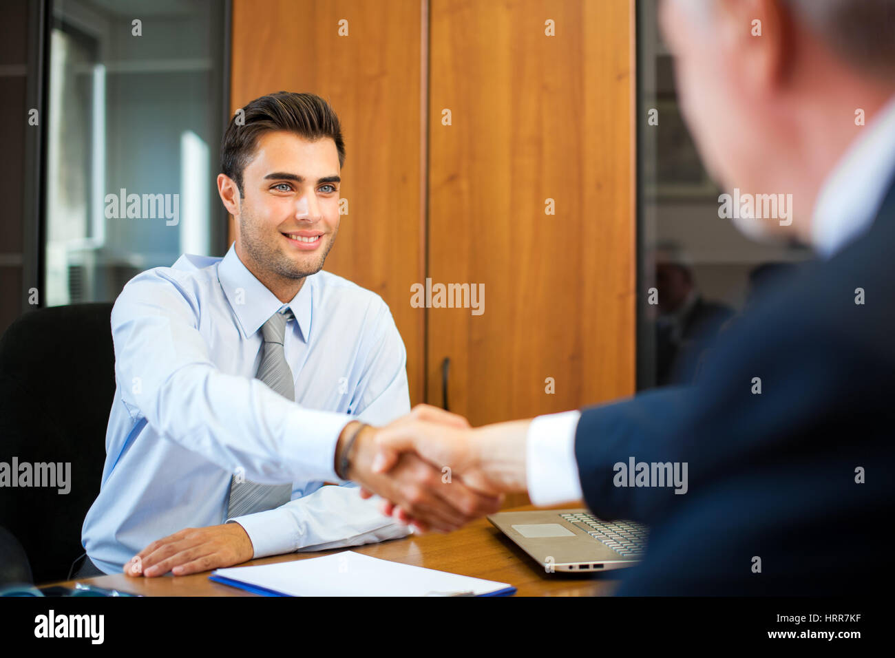 Business people shaking their hands Stock Photo - Alamy
