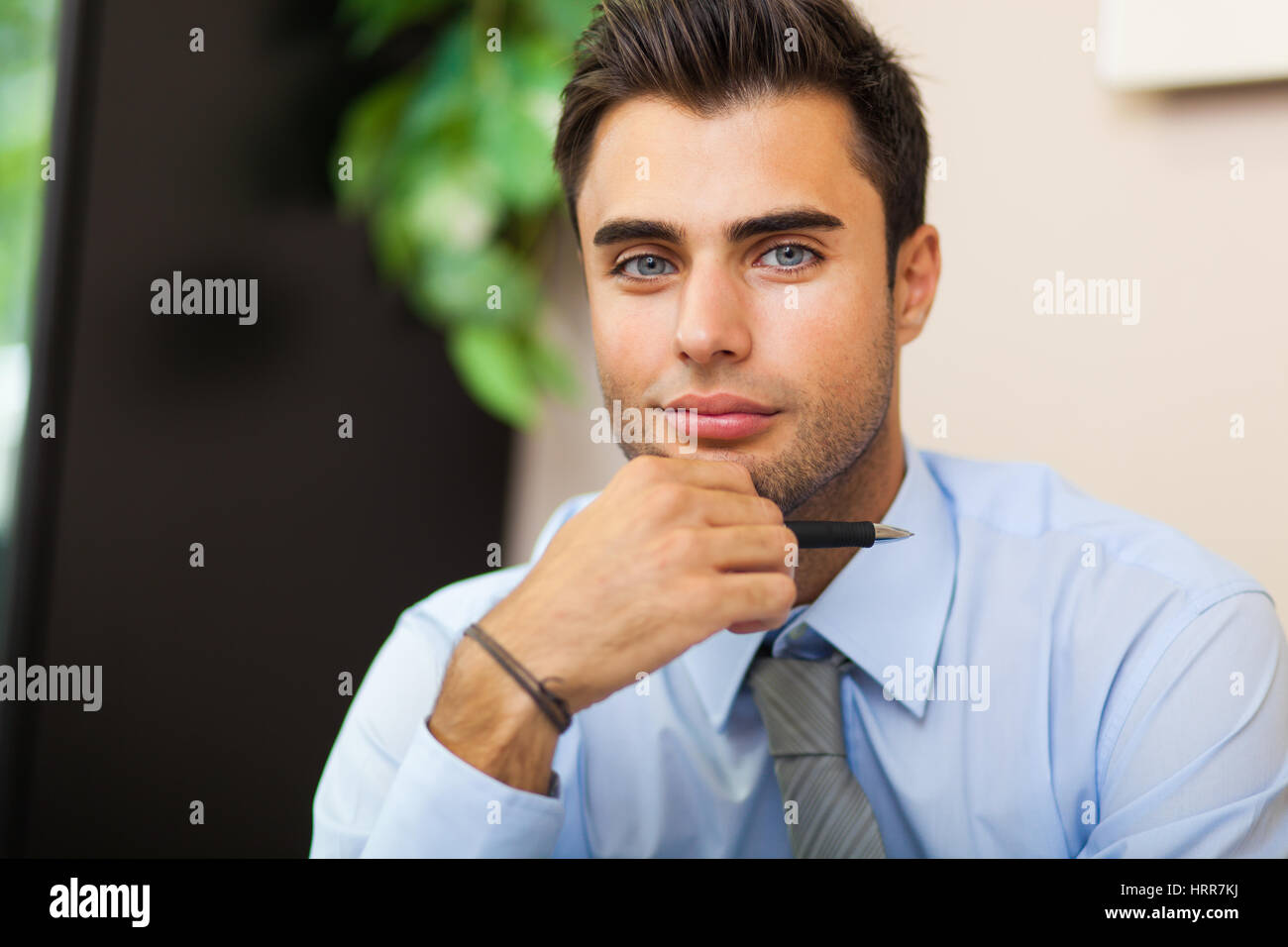 Young businessman in his office Stock Photo - Alamy