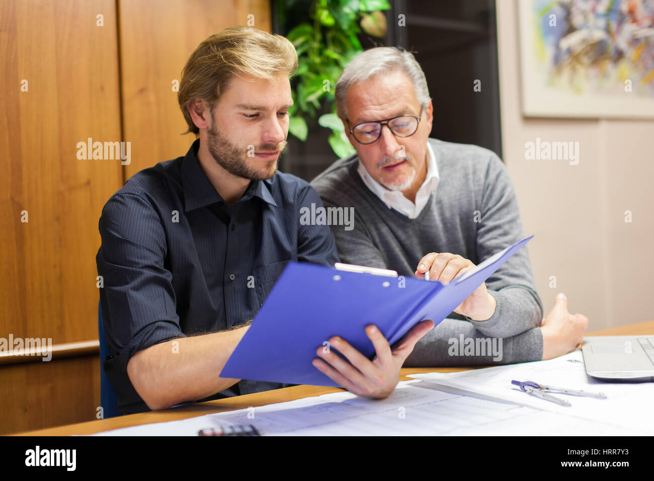 Two employees at work in an office Stock Photo - Alamy