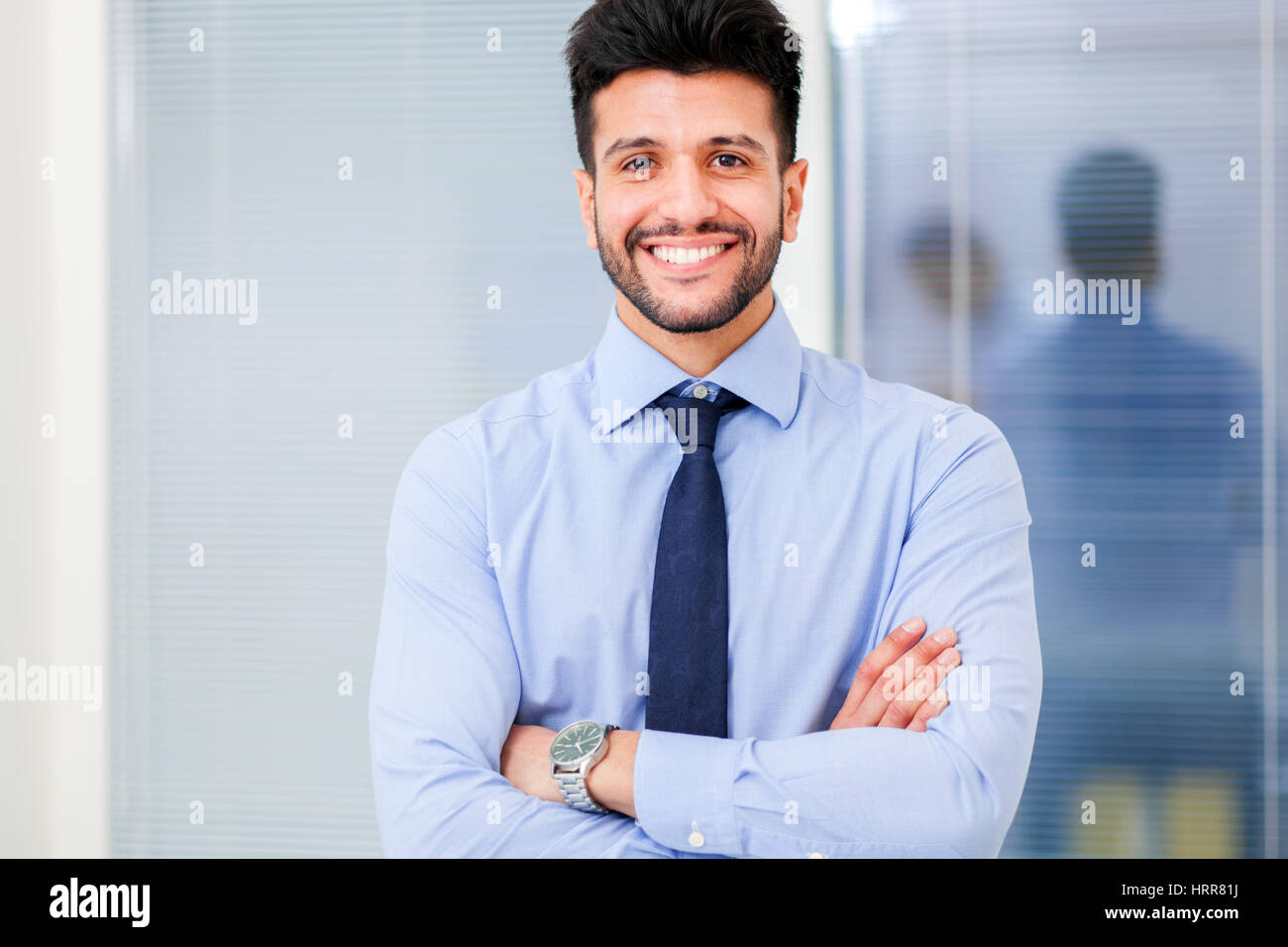Smiling young businessman Stock Photo - Alamy
