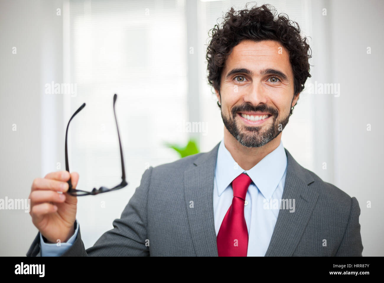 Handsome manager in his office Stock Photo - Alamy