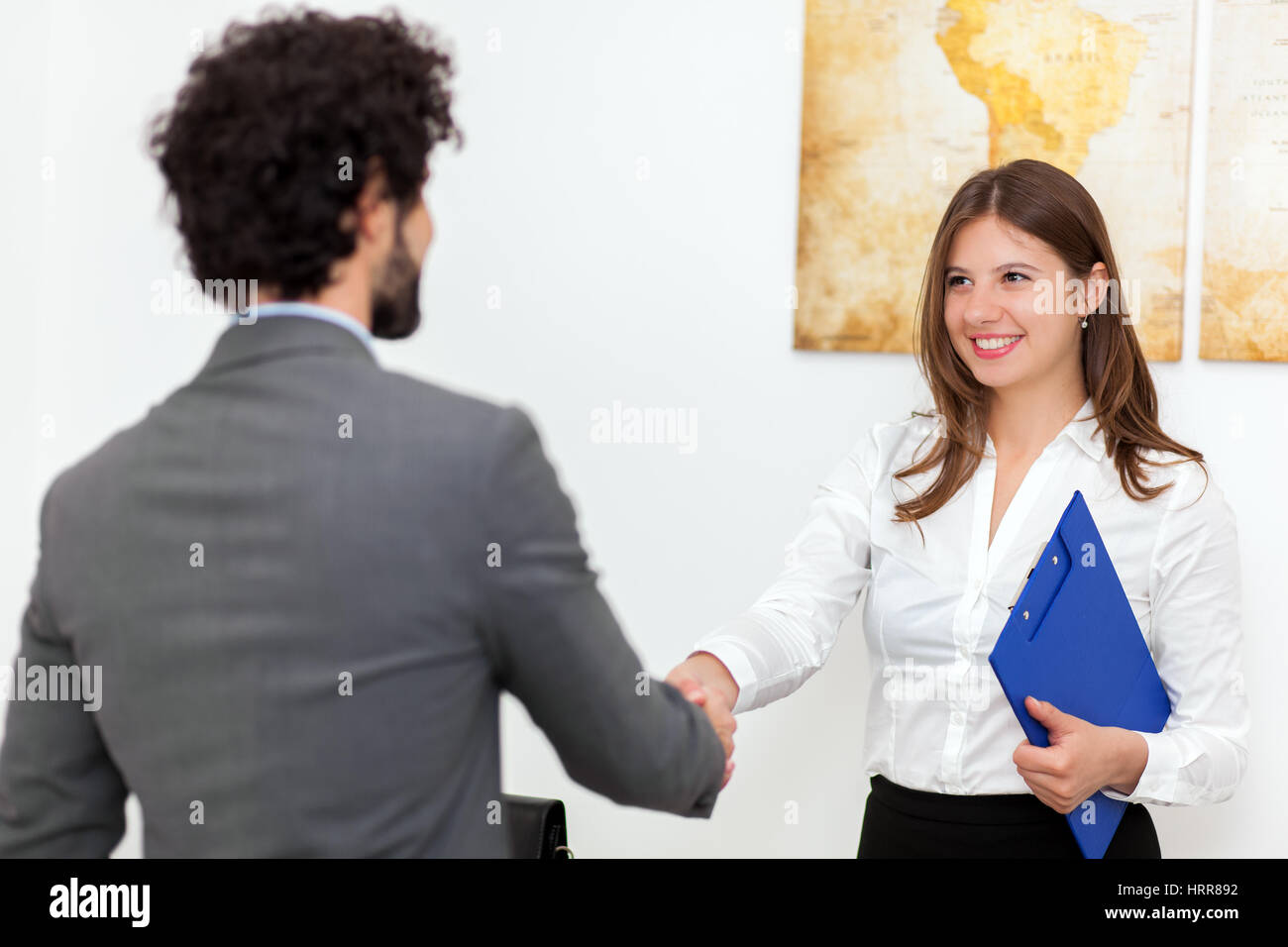 Businesspeople giving handshake in the office Stock Photo - Alamy