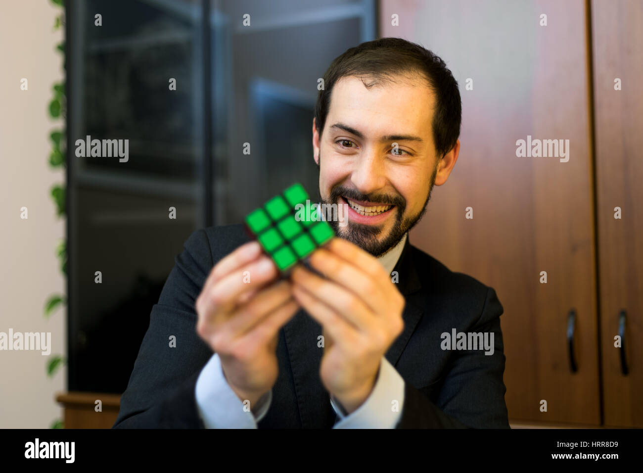 Man with rubik cube hi-res stock photography and images - Alamy