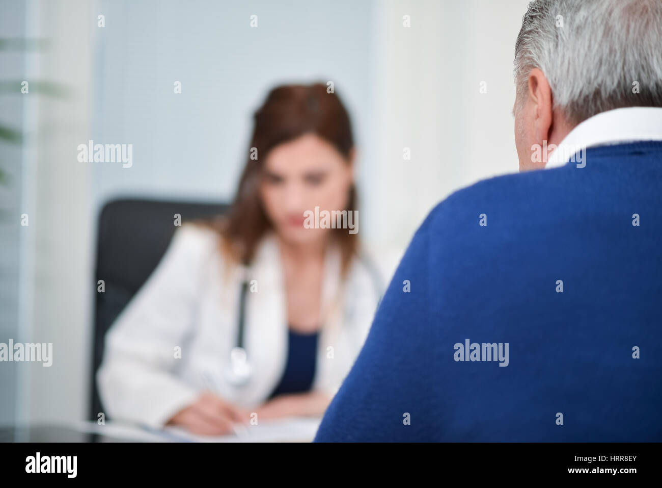 Doctor visiting a patient Stock Photo - Alamy