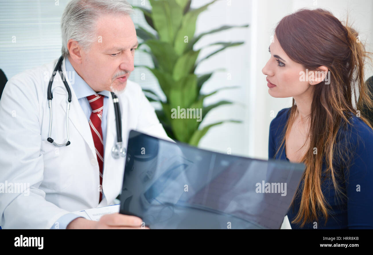 Doctor talking to a patient in his studio Stock Photo - Alamy