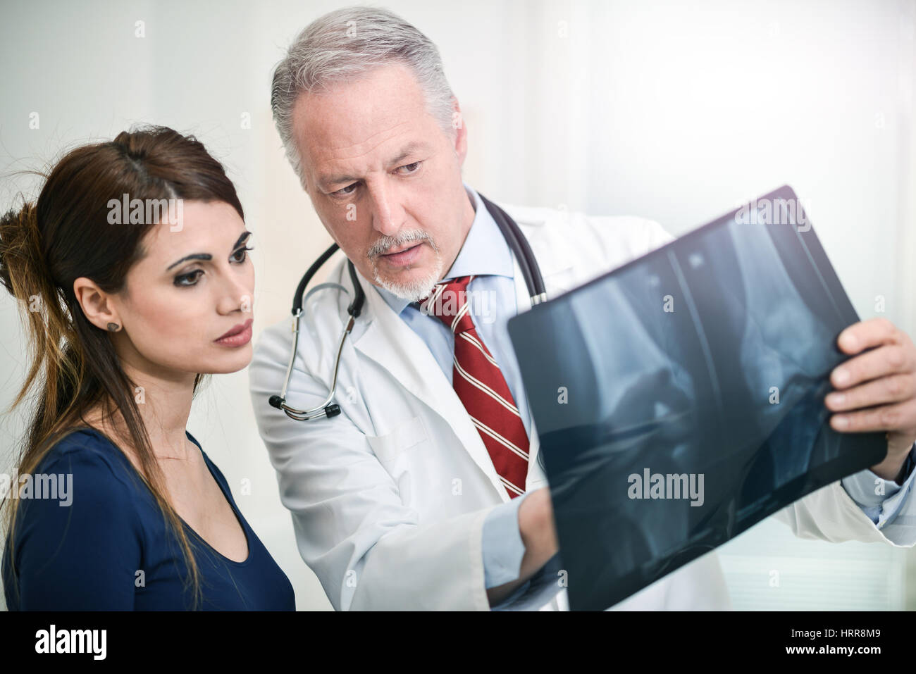 Doctor talking to a patient in his studio Stock Photo - Alamy