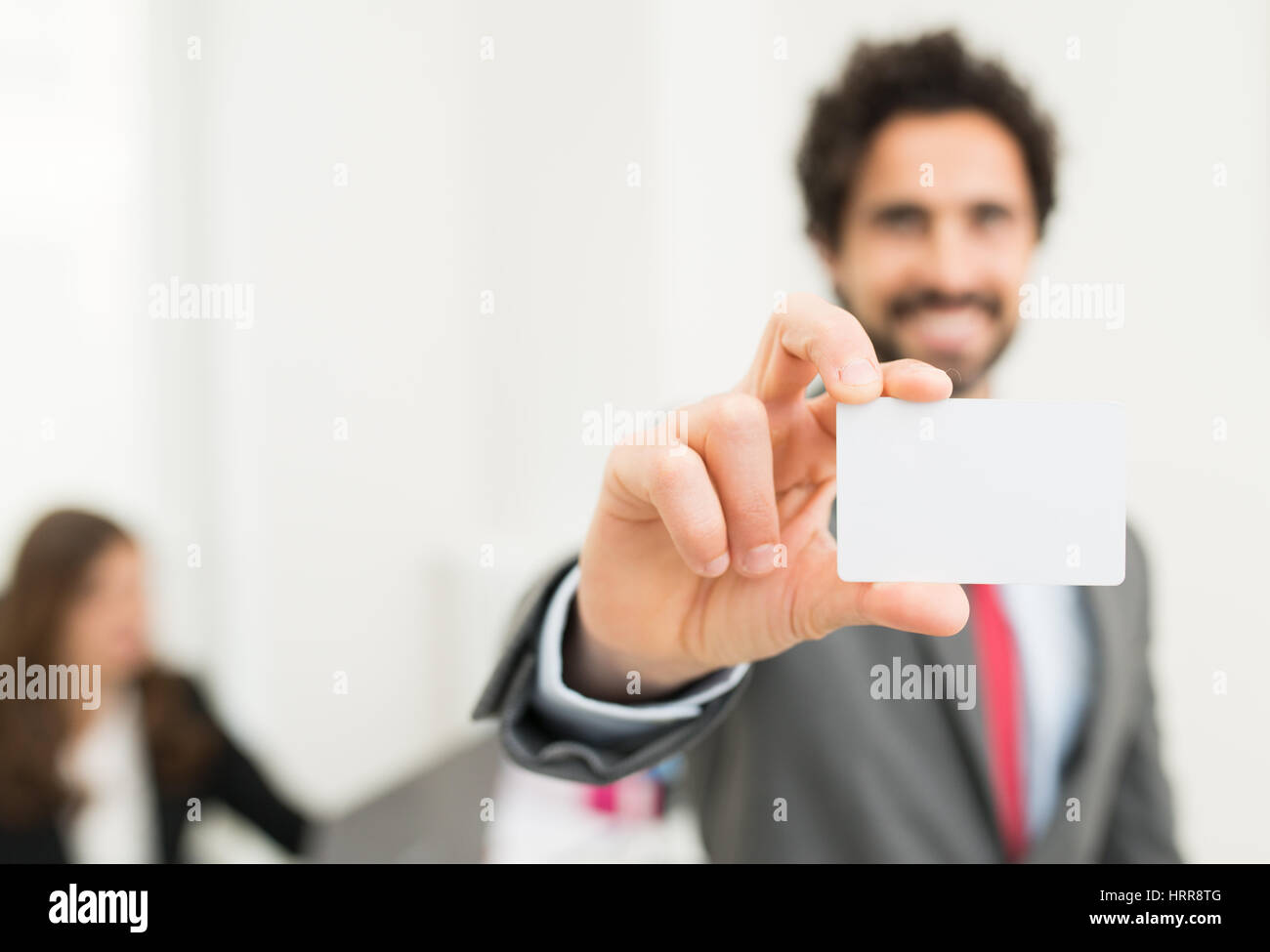 Businessman showing business card hi-res stock photography and images ...