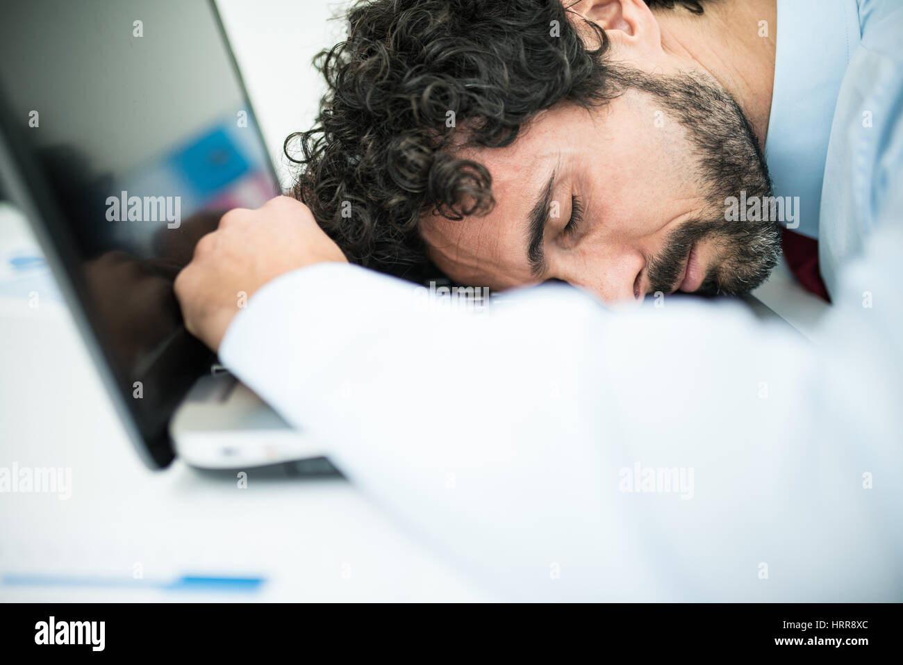 Very tired businessman sleeping on his computer Stock Photo - Alamy