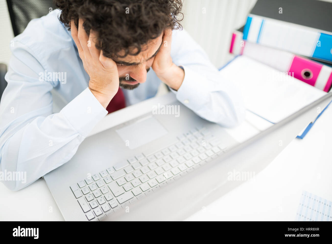 Sad businessman at his desk Stock Photo - Alamy