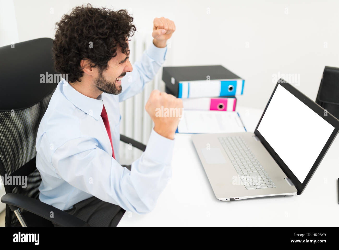Happy man looking at a blank computer screen Stock Photo - Alamy