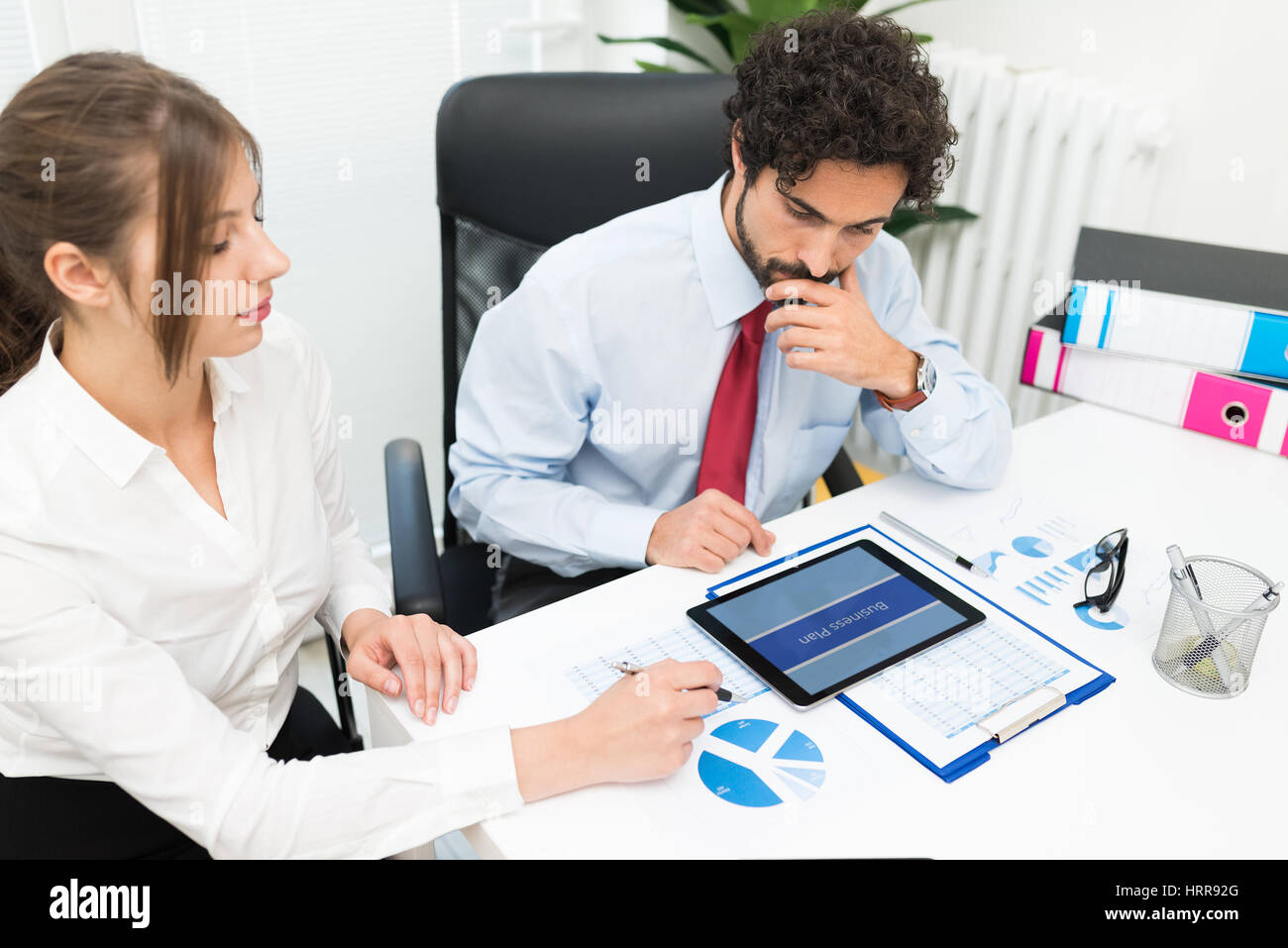 Business people at work in a modern office. Focus on the man Stock ...