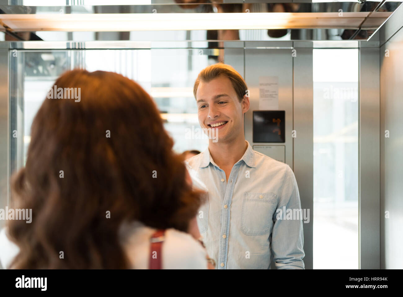 In elevator young man woman hi-res stock photography and images - Alamy