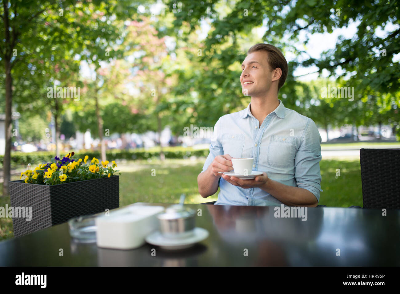 Man drinking a coffee in a cafe Stock Photo - Alamy
