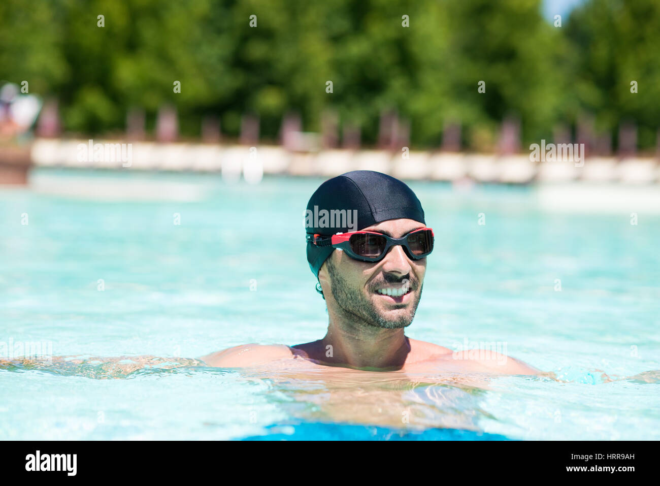 Young man swimming in hi-res stock photography and images - Alamy