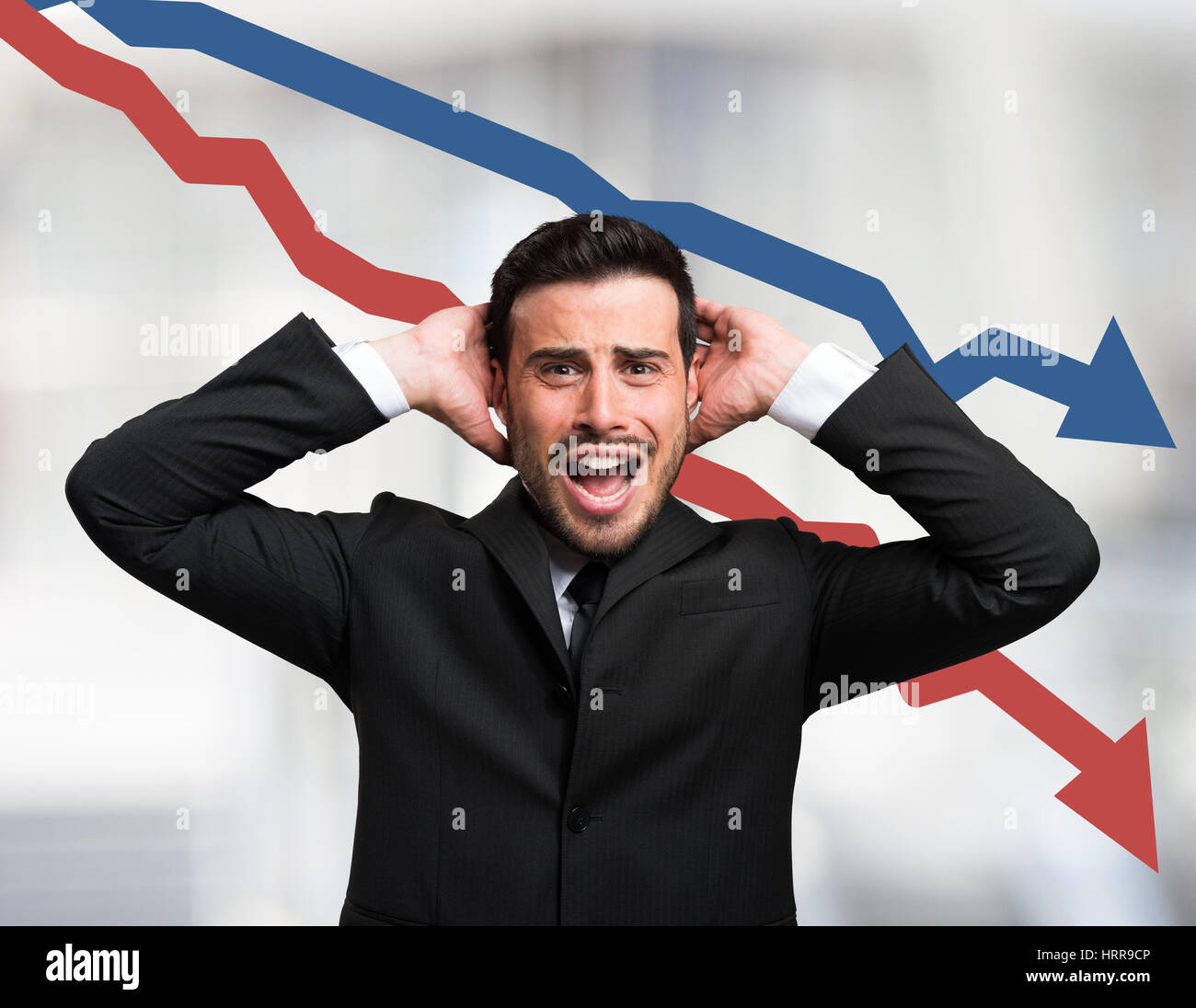 Desperate businessman in front of descending arrows Stock Photo - Alamy