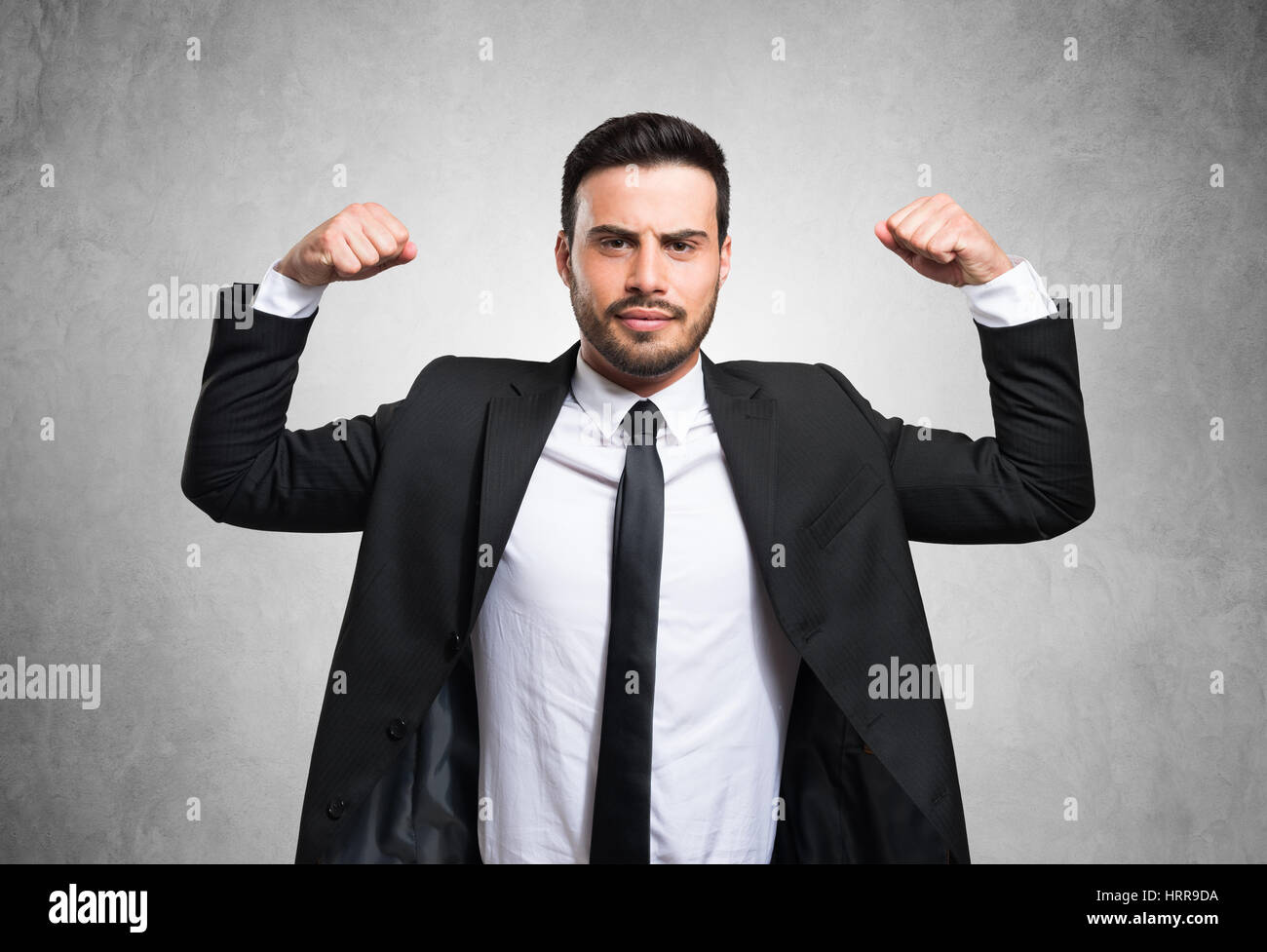 Successful businessman muscles success hi-res stock photography and ...